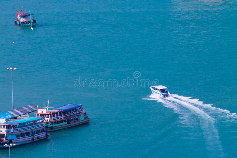 Tow Boat Moving Along the Sea with Large White Cruise Liner on ...