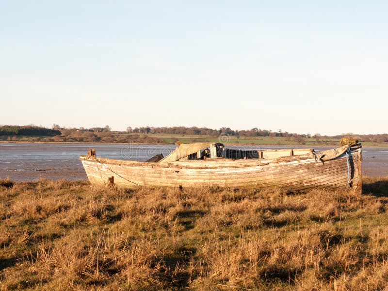 Boat in the Mud with the Tide Out Stock Photo - Image of harbor, coast ...