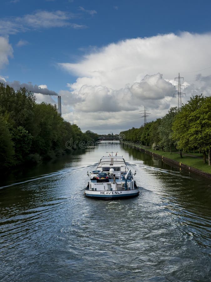 Boat Navigating River between Trees and Power Lines in Oberhausen ...
