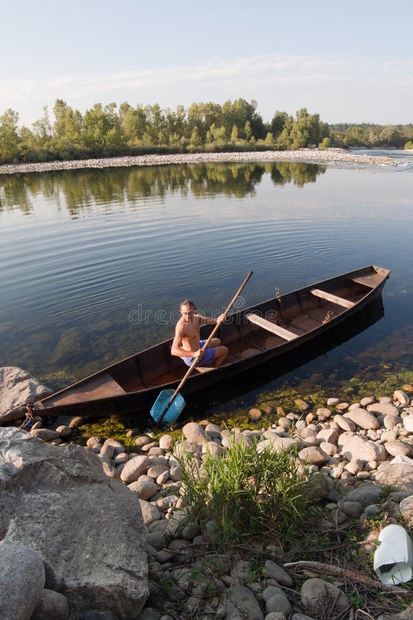 Boat oarsman on river stock image. Image of landing, rower - 26021991