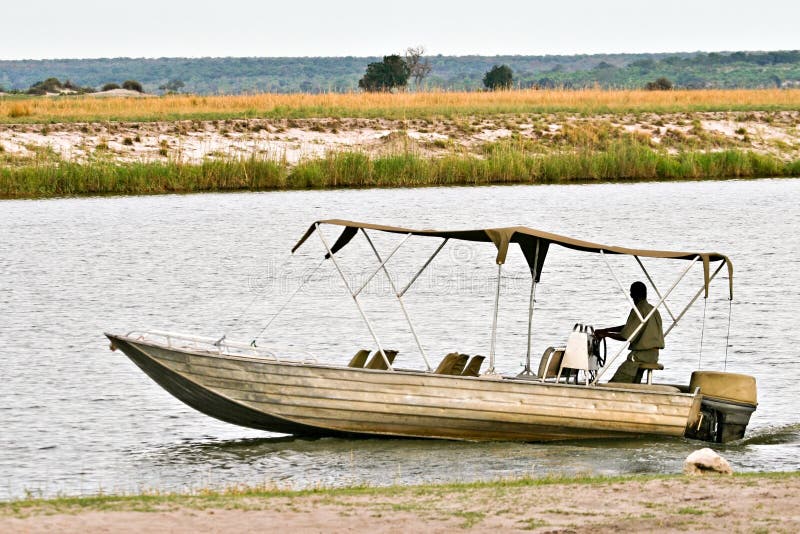 Boat in the Okavango Delta stock photo. Image of adventure - 2940746