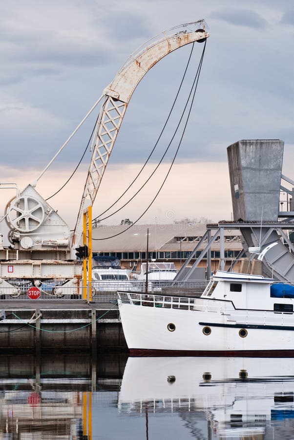 Boat and old crane. stock image. Image of crane, loading - 12270557