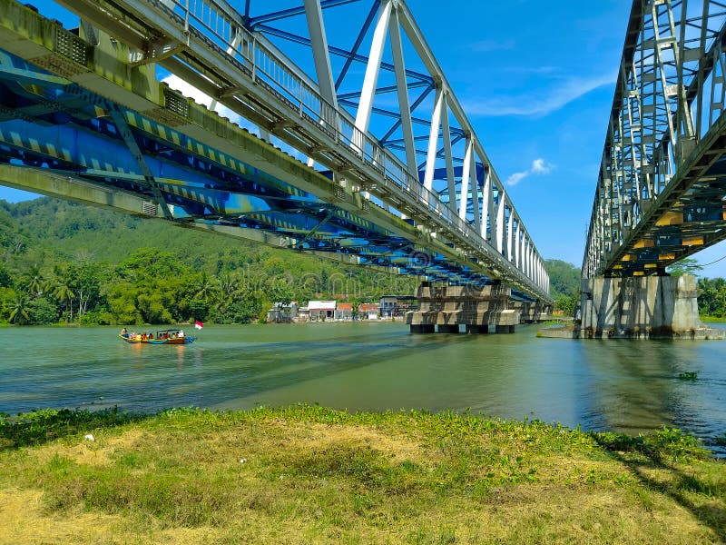 A Boat Passes Under a Train Bridge Stock Image - Image of construction ...