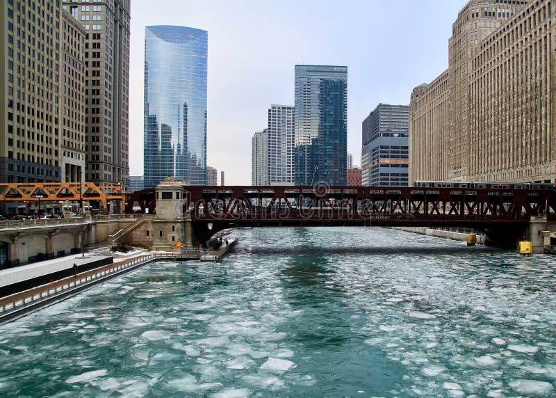 Boat Path through Ice Chunks in a Freezing Chicago River Which is Aqua ...