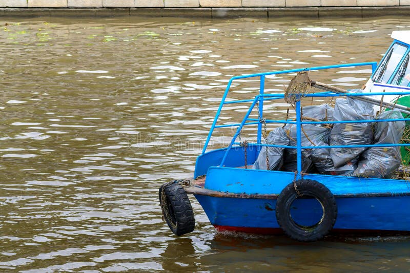 Boat Picking Up Trash from the River. Stock Photo - Image of pollution ...