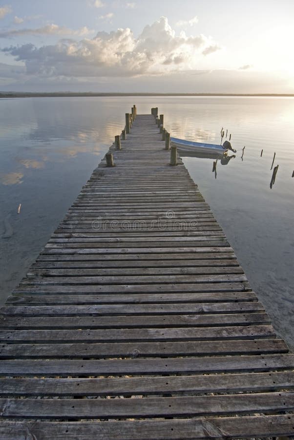 Boat pier at sunset stock image. Image of boat, water - 6570599