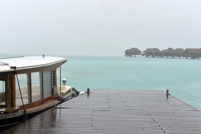 Boat in rain stock photo. Image of rainstorm, coconut - 34368170