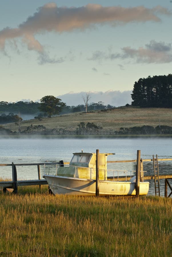 Boat in Reeds by River Bank Stock Photo - Image of river, journey: 13415718