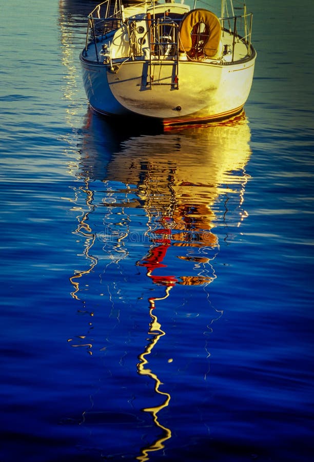 Boat Reflected on Blue Lake Water Stock Image - Image of boating, canada: 322624041