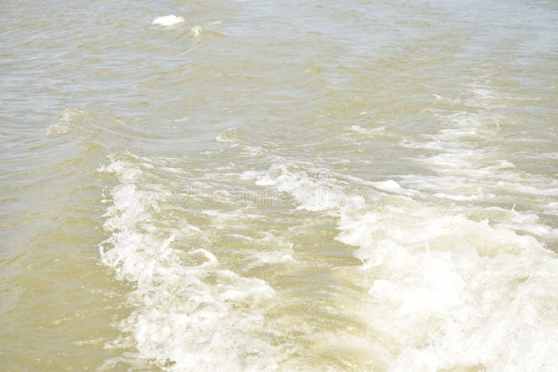 Boat Ripples in Water stock photo. Image of yellow, unclear - 77501180