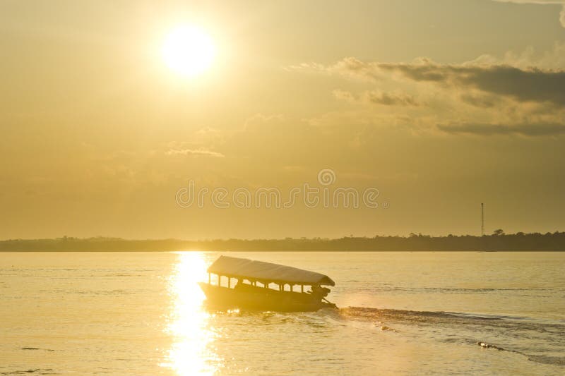 Boat on River Amazon at Sunset Stock Photo - Image of sunny, jungle ...
