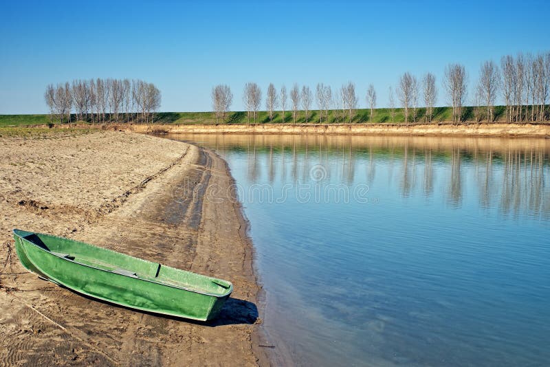 Boat on river bank stock image. Image of coastline, natural - 19298411