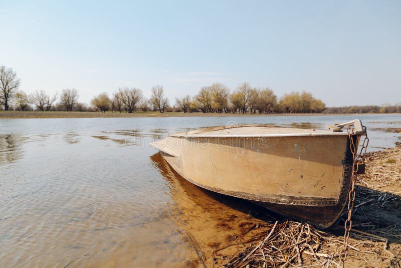 Boat at the riverside stock photo. Image of tree, pond - 69627598