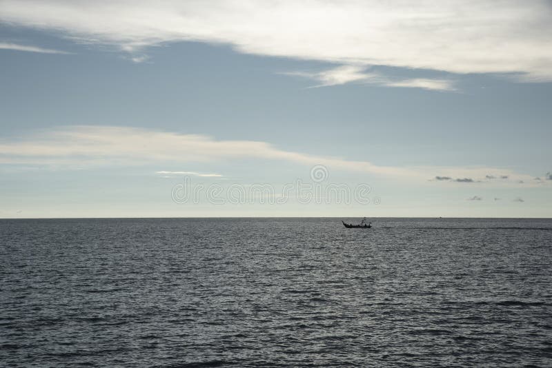 Boat Sailing Along the Distance Ocean in the Horizon. Stock Image ...