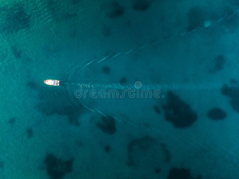 Boat Sailing on Azure Sea Water. Top Down Drone View Stock Photo ...