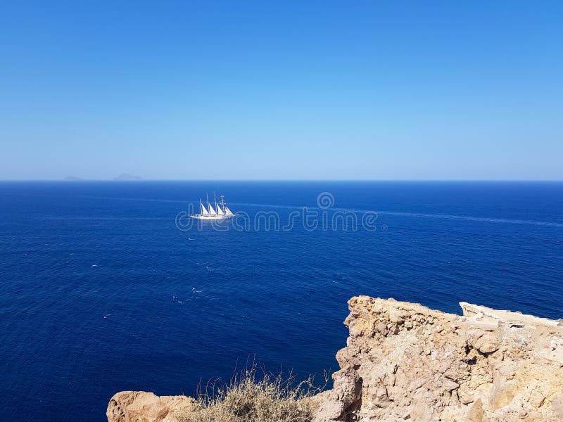 Boat Sailing on a Big Blue Ocean Stock Photo - Image of deserted, rock ...