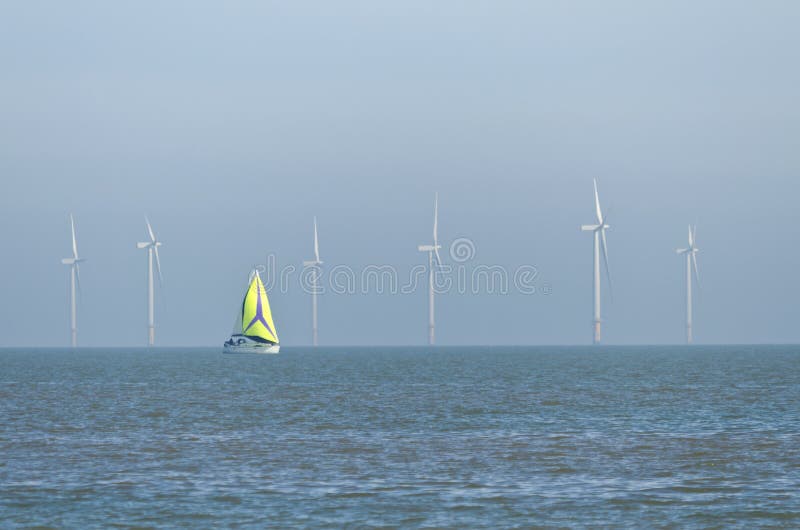 A Boat Sailing Past a Wind Farm Stock Image - Image of ocean, coastal ...