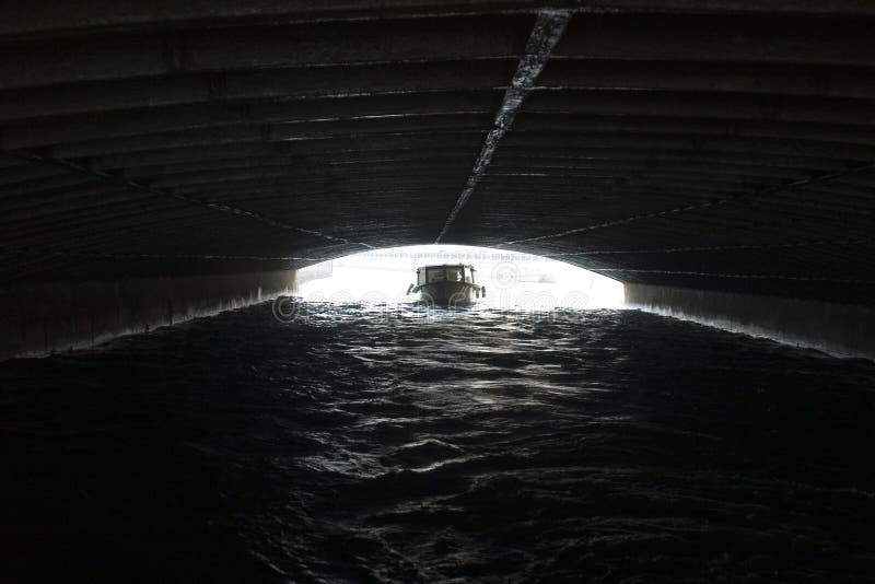 Boat sailing under bridge stock photo. Image of watercraft - 807572