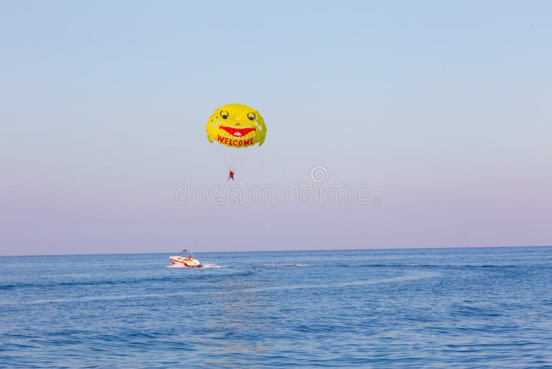 Boat sea smile parachute editorial stock image. Image of beach - 96779544