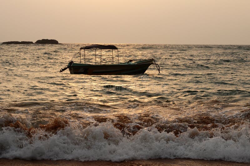 Boat at seashore stock photo. Image of ocean, sunrise - 23674078