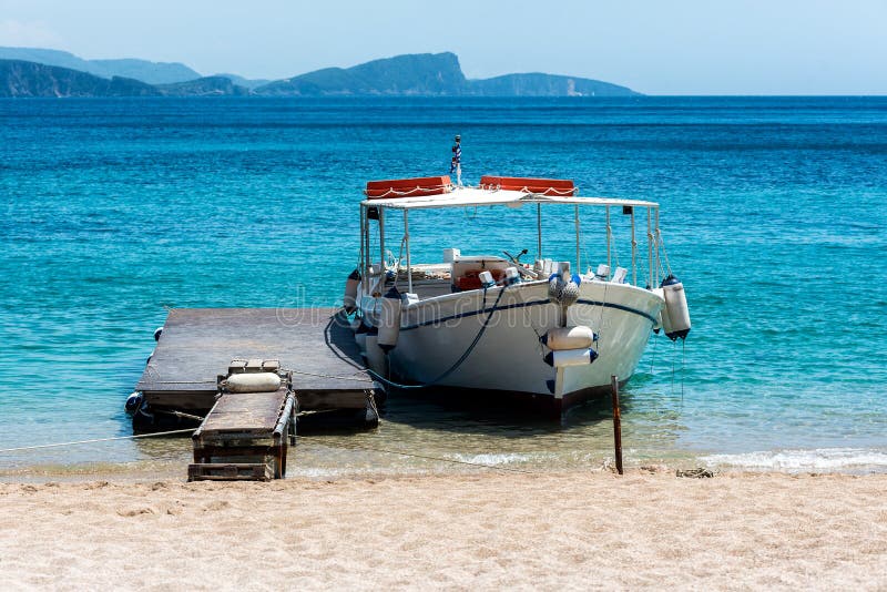 Boat at the Small Pier on the Beach Stock Photo - Image of mood ...
