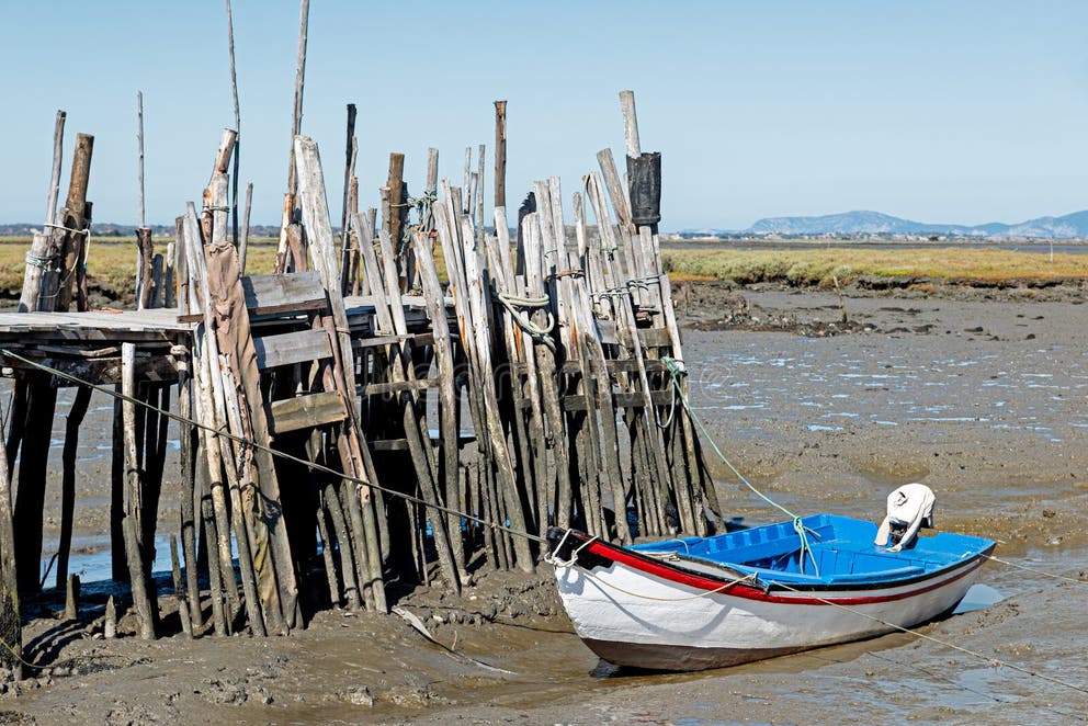 Boat stranded at low tide stock image. Image of seascape - 383490975