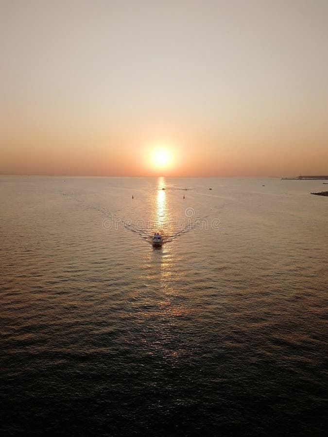 A boat and sun lights stock photo. Image of sunbeam - 273683992