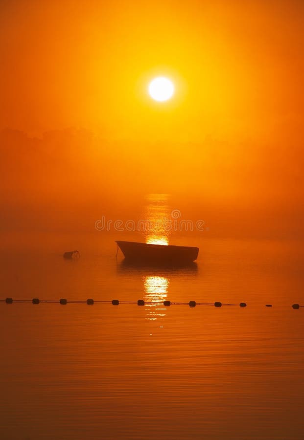 Boat at sunrise stock image. Image of landscape, sunset - 10503433