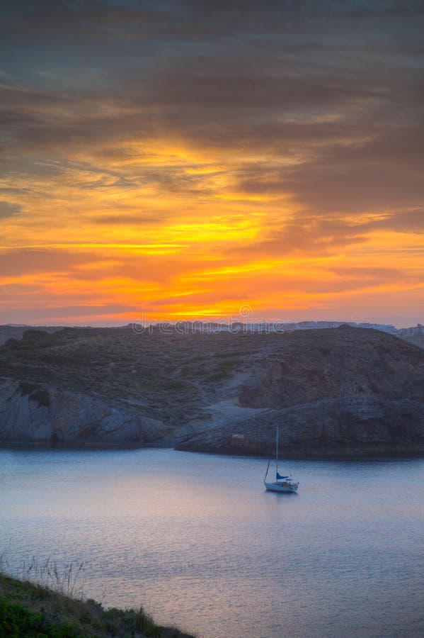 Boat at sunset stock image. Image of coast, cliff, horizon - 25445191