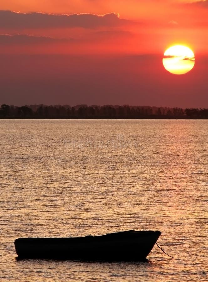 Boat at sunset stock image. Image of reflect, water, reflection - 5550465