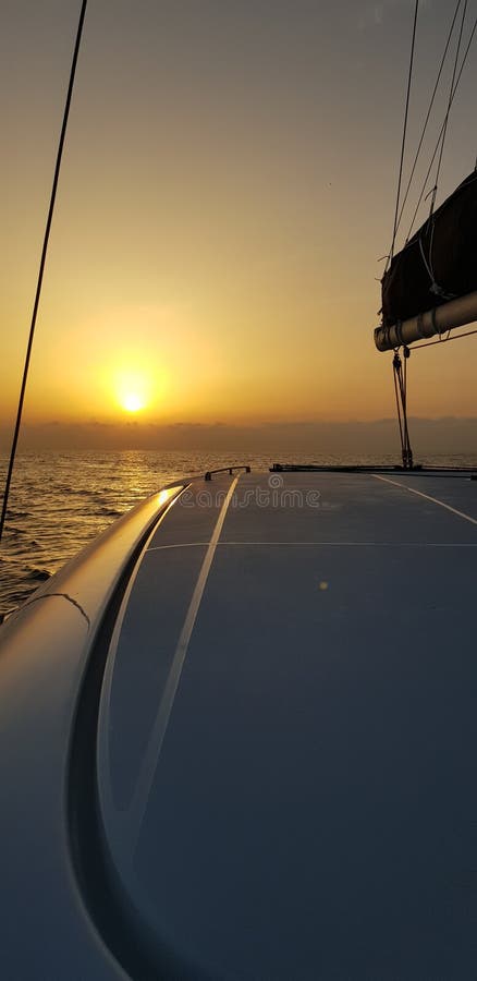 Sunset by the sea stock image. Image of sunset, boat - 112188687