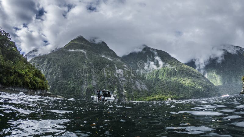 Boat on a Surface and Steep Cliffs Stock Photo - Image of breathtaking ...