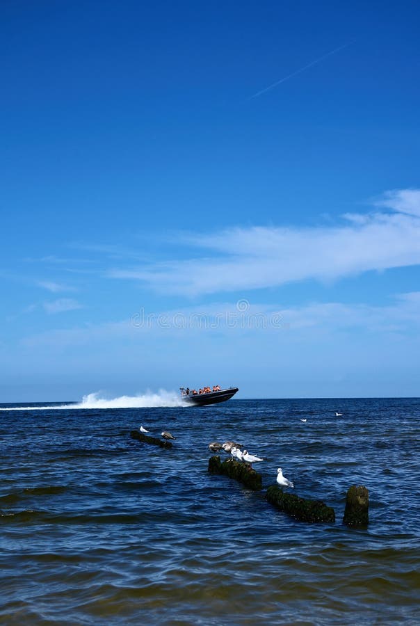 Boat with Tourists Racing on the Sea Waves Stock Photo - Image of walk ...