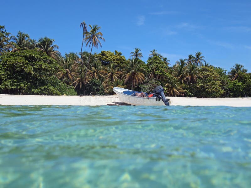 Boat on a tropical beach stock image. Image of exotic - 28474195