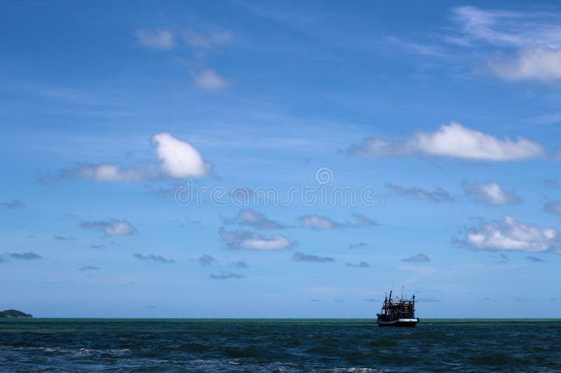 A boat on a vast ocean stock image. Image of blue, freedom - 91557075