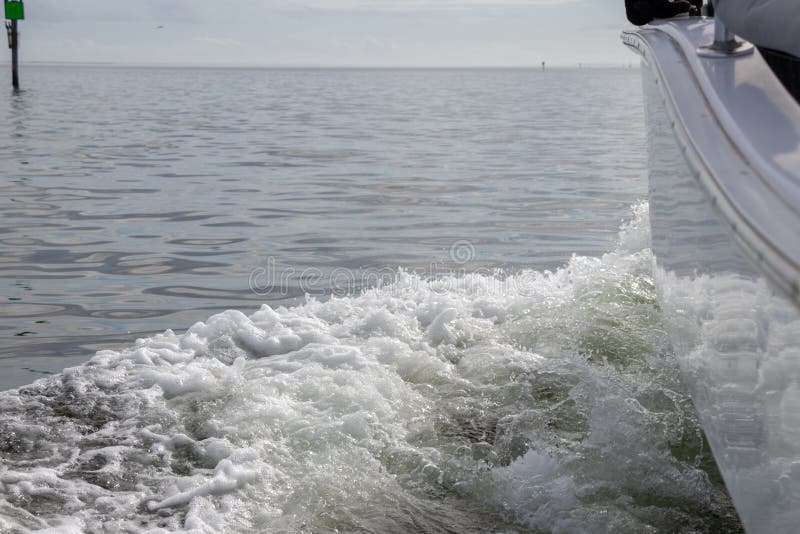 Boat Wake Reflecting Off the Side of Boat Stock Photo - Image of side ...