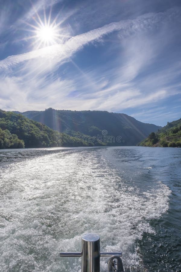 Boat Wake with a River Landscape with Mountains in the Background and a ...