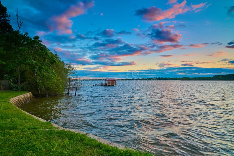 Boathouse on Lake Tyler, Texas with Colorful Clouds Stock Photo - Image ...