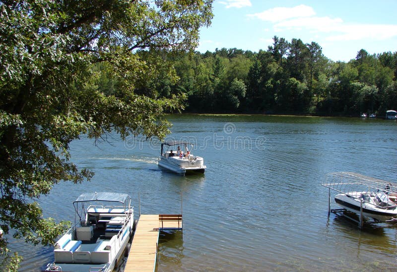 Boating fun stock photo. Image of summer, lakeshore, grass - 1723844