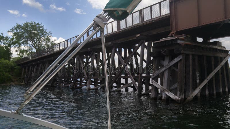 Boating on Lake Under Wooden Bridge Stock Image - Image of lake, wooden ...