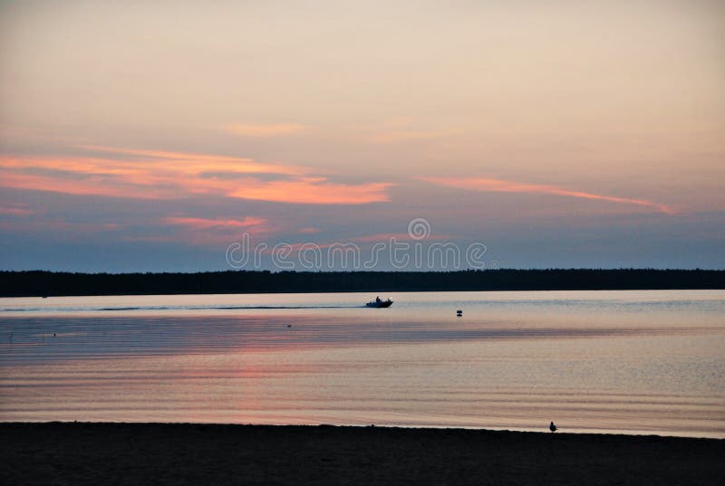 Boating in the sunset stock image. Image of water, pink - 58278709