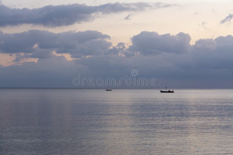 Boats on Calm Sea Under a Gray Sky Stock Image - Image of mist, boat ...