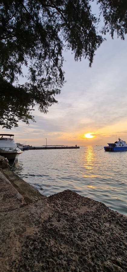 Boats beside the Docks with Sunset Views Stock Image - Image of light ...