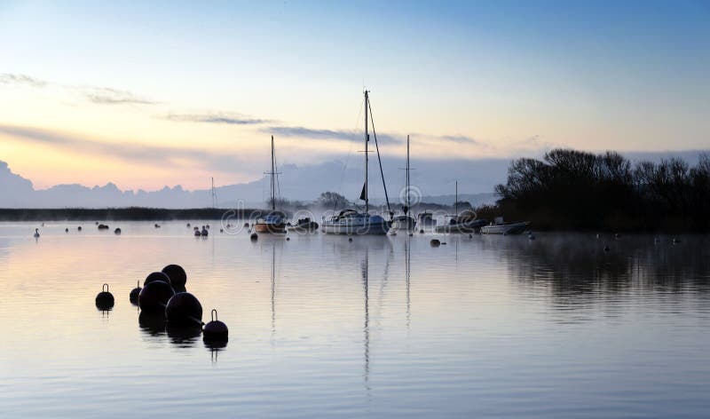 Boats and Early Morning Mist Stock Photo - Image of sunset, yachts ...