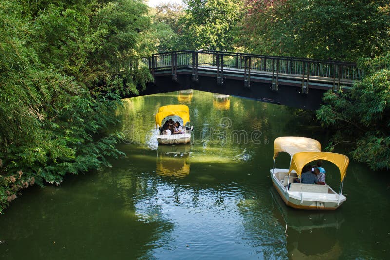 Boats Going Under a Bridge in Luisenpark Editorial Photography - Image ...