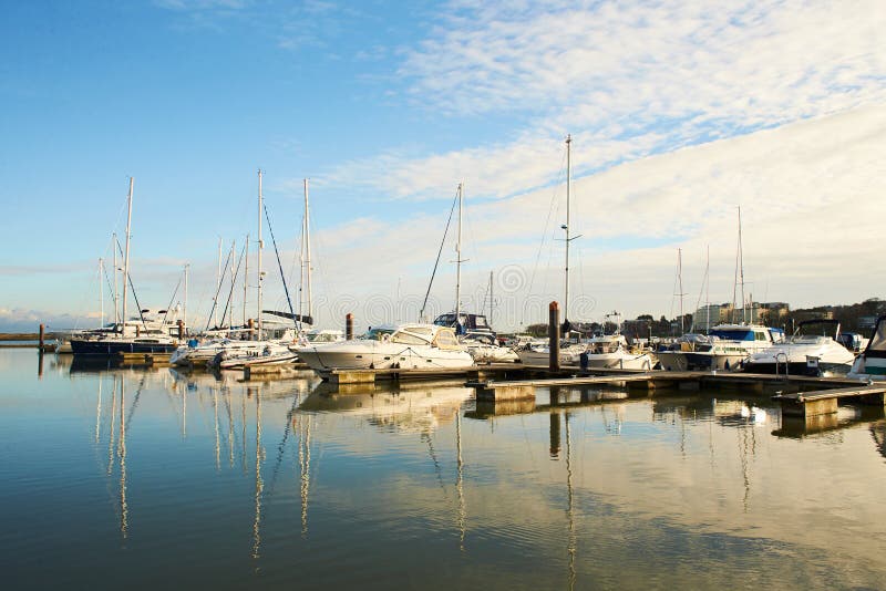 Boats in Harbor with Blue Colorful Cloudy Sky in Background. Stock ...