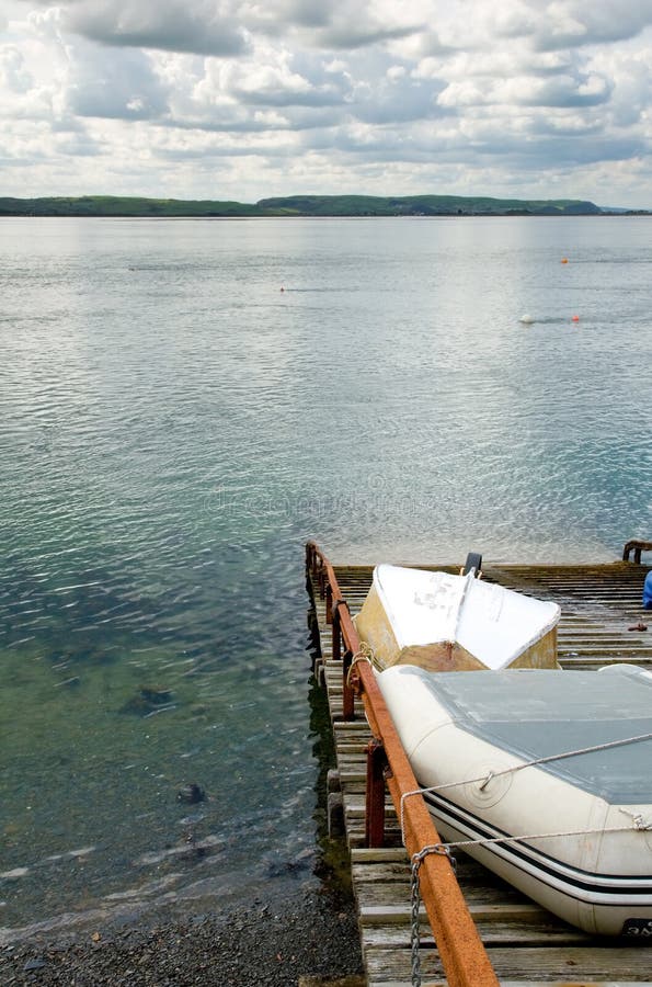 Boats on jetty stock image. Image of deck, blue, harbor - 24754085