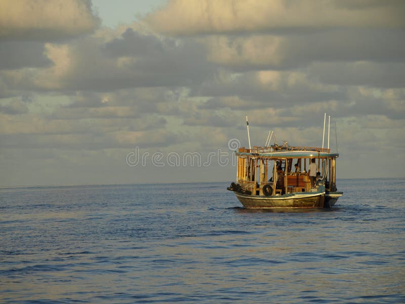 Boats on the Maledivan sea stock photo. Image of sailing - 128830220