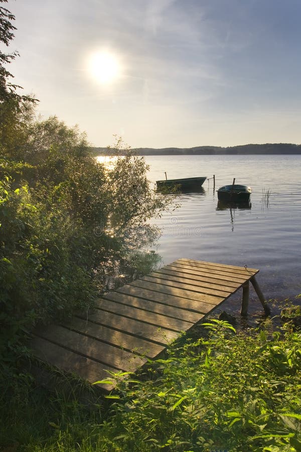 Boats moored on lake stock image. Image of landscape - 26868953
