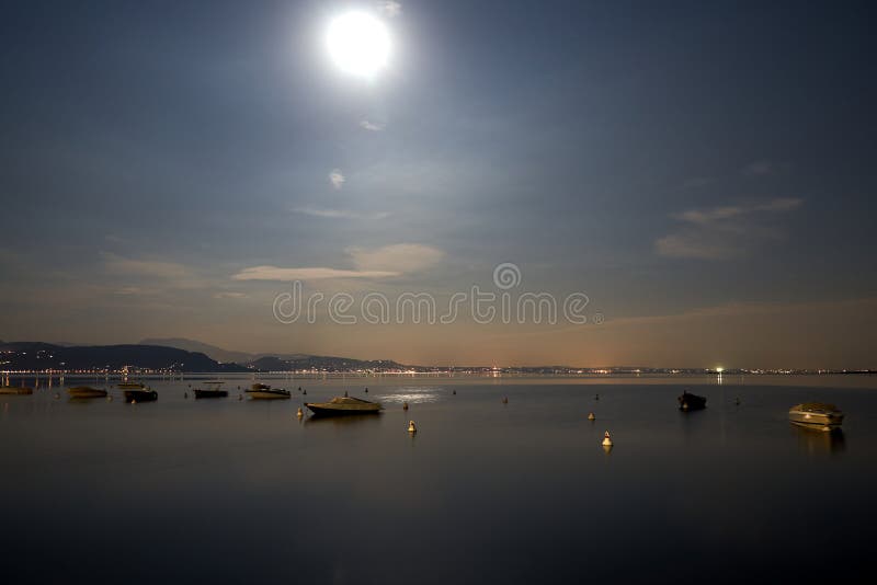 Boats at Night in the Moonlight on Lake Garda Stock Photo - Image of ...